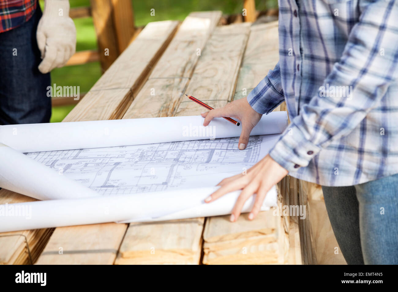 Architect With Blueprint At Site Stock Photo - Alamy