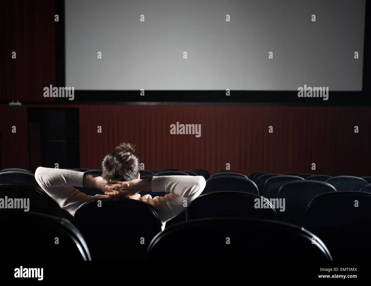One man relaxing cinema hi-res stock photography and images - Alamy