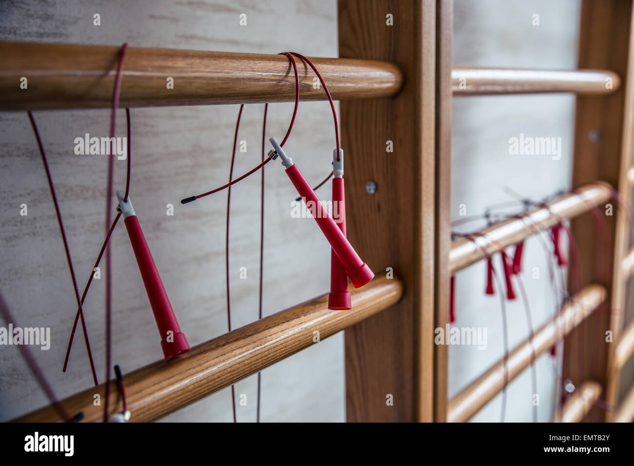 Closeup image of a jumping ropes on wall bars Stock Photo - Alamy