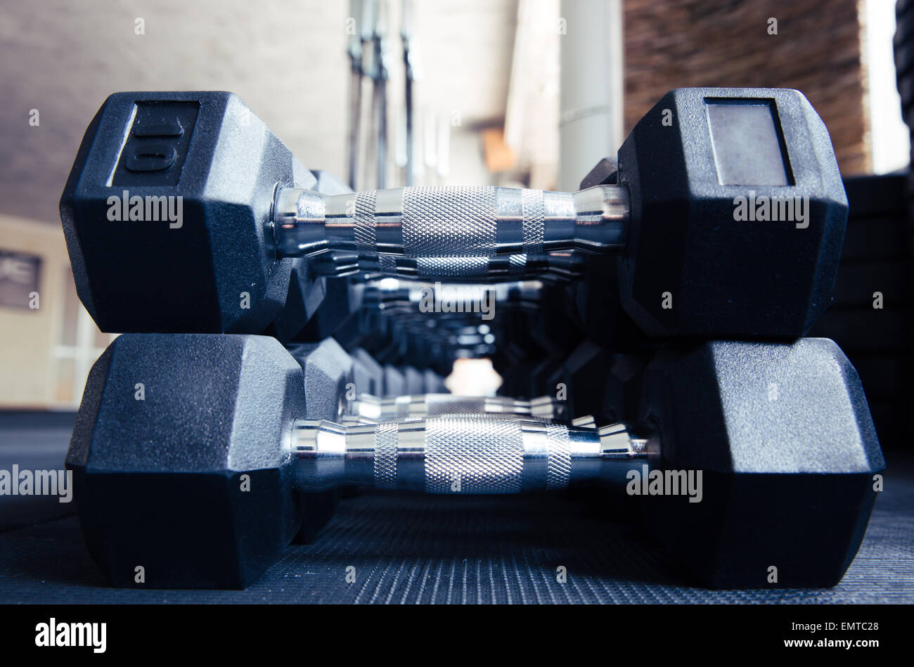 Closeup image of a dumbbells in gym Stock Photo - Alamy
