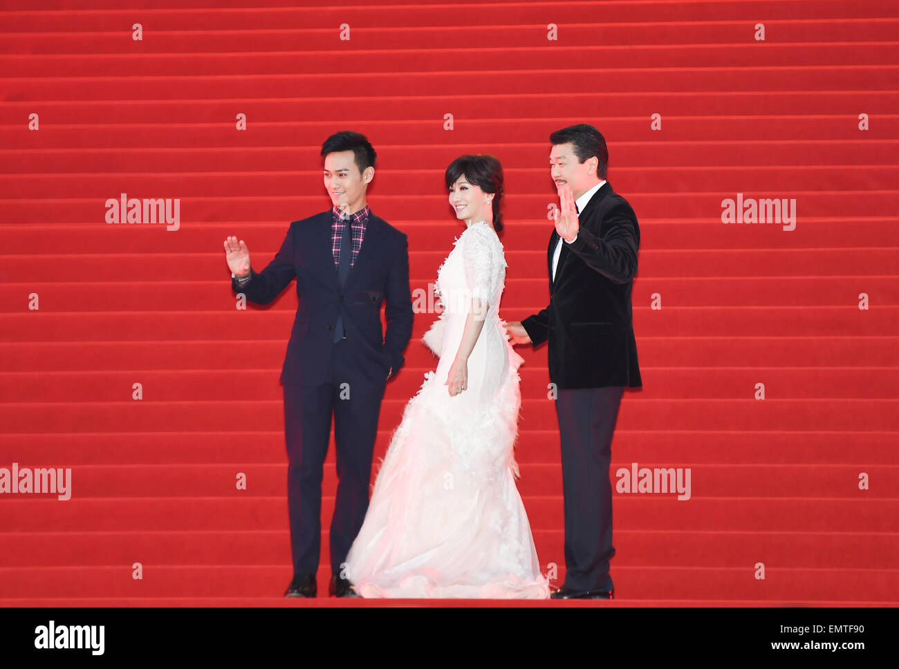 Beijing, China. 23rd Apr, 2015. Actress Angie Chiu (C) walks the red ...