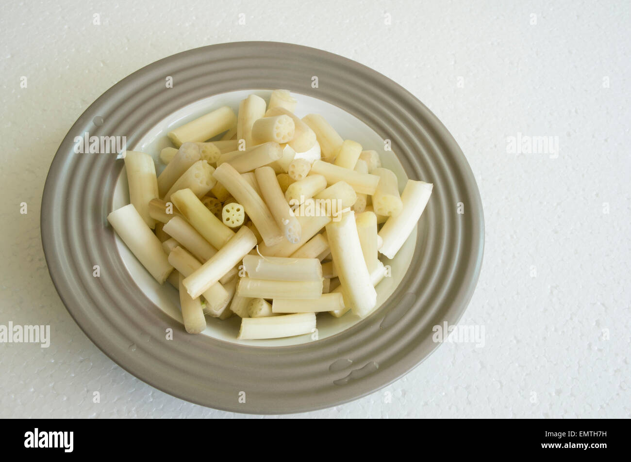 lotus root stalk plant food preparation eat Stock Photo - Alamy