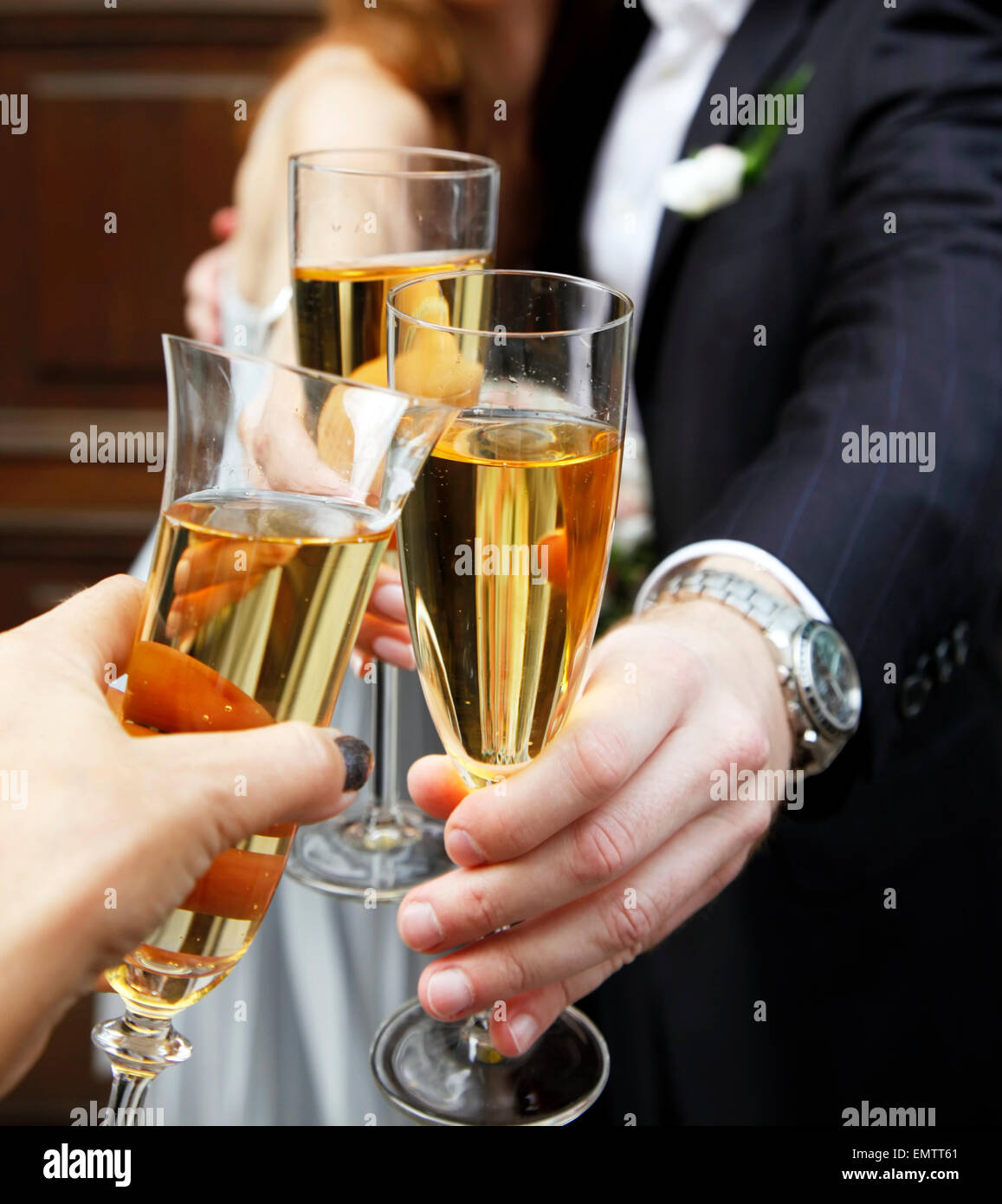 Glass of champagne in a hands of the groom and bride Stock Photo - Alamy