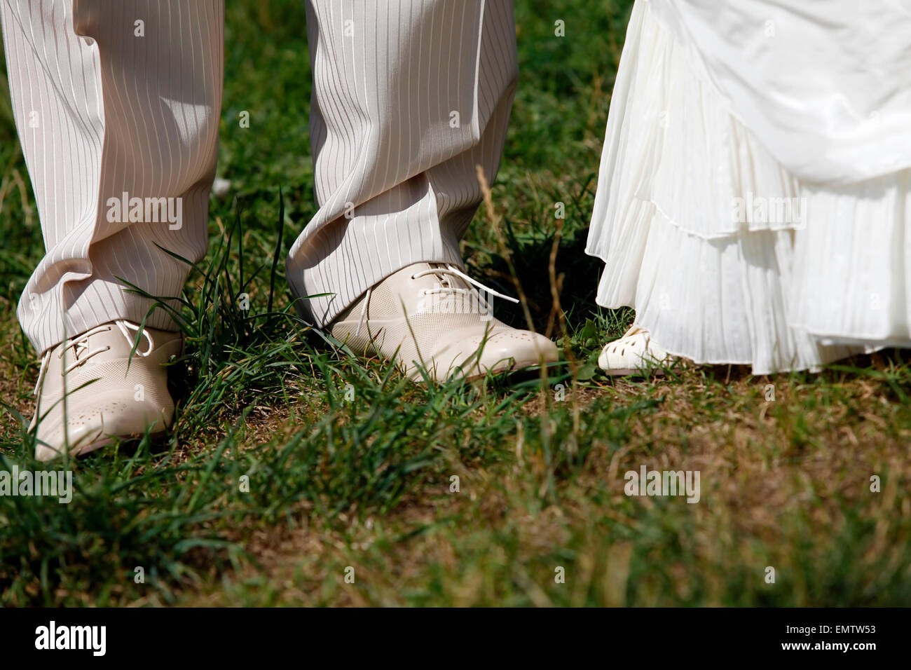 Legs of the groom and the bride Stock Photo - Alamy