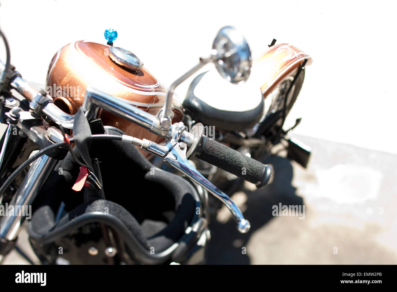 A gold custom painted motorcycle. The gold and bright blue details on ...