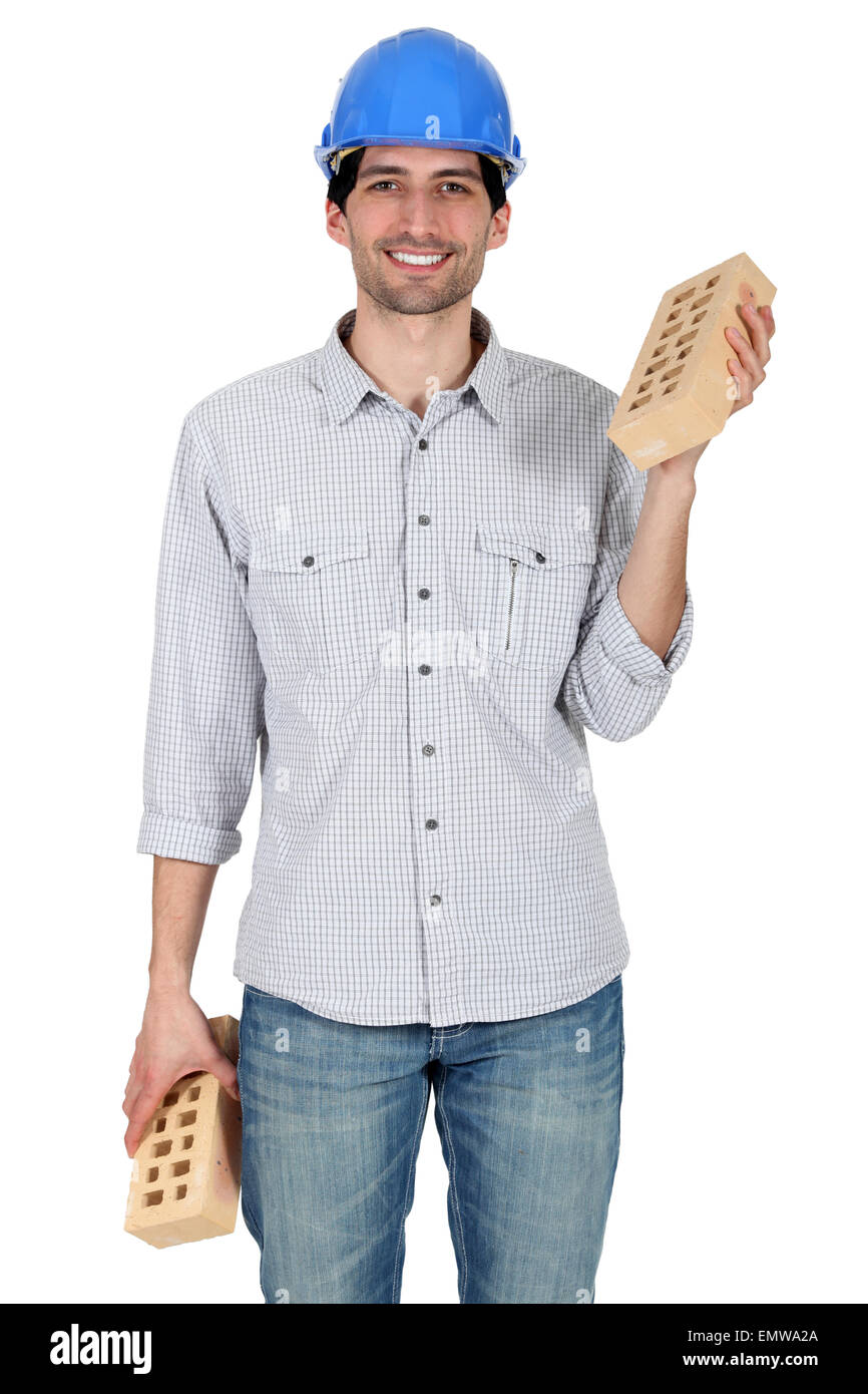 Builder carrying bricks hi-res stock photography and images - Alamy