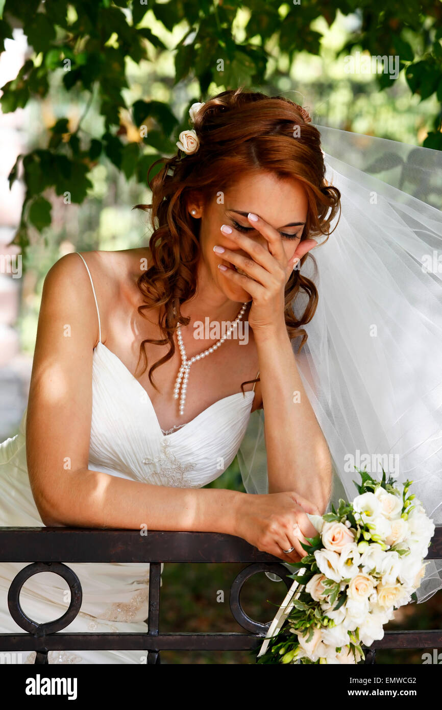 The beautiful bride on a green background Stock Photo - Alamy