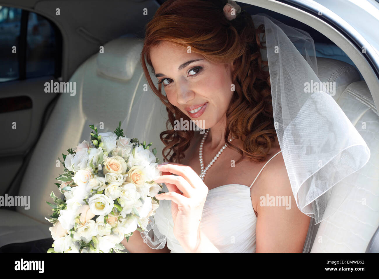 The beautiful bride in the automobile Stock Photo - Alamy