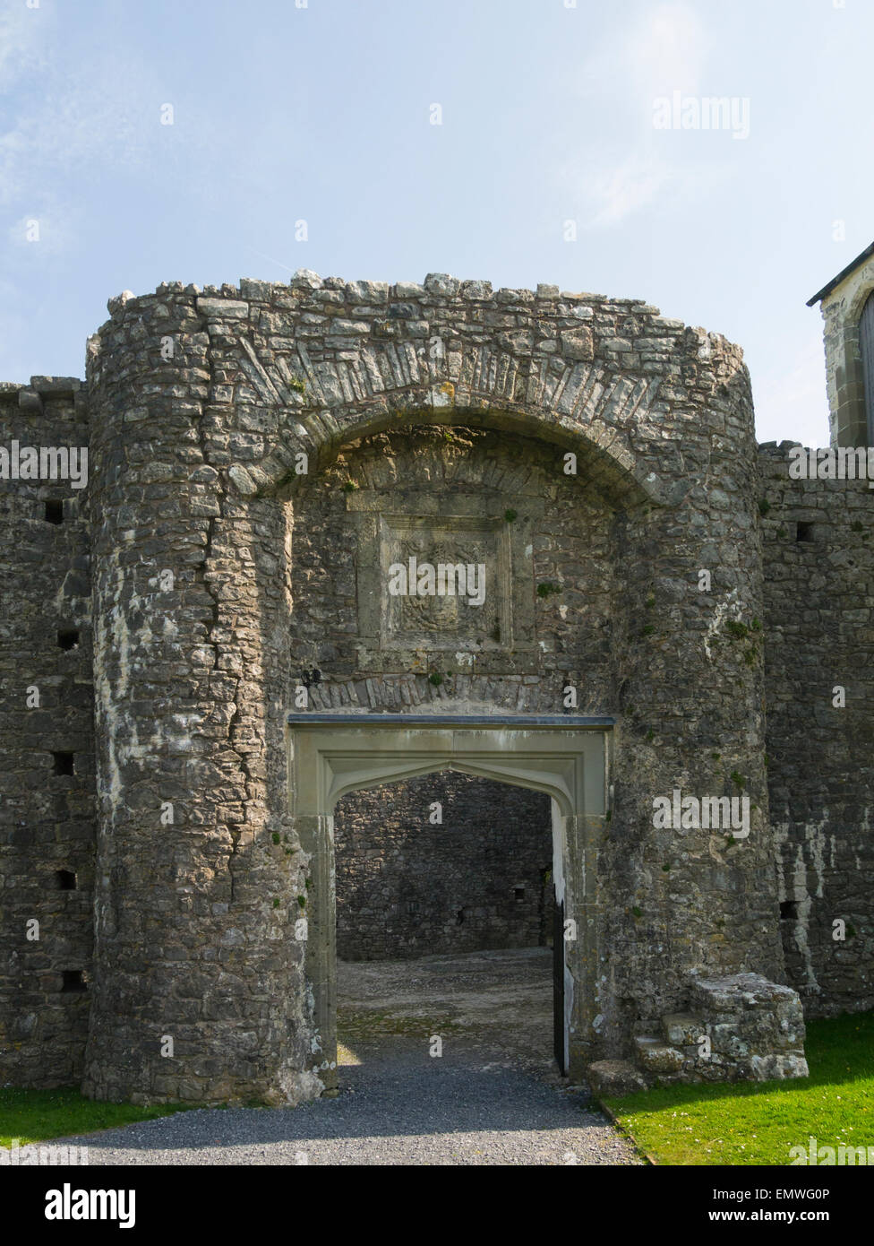 Oxwich Castle gatehouse with Mansel family coat of arms over entrance ...