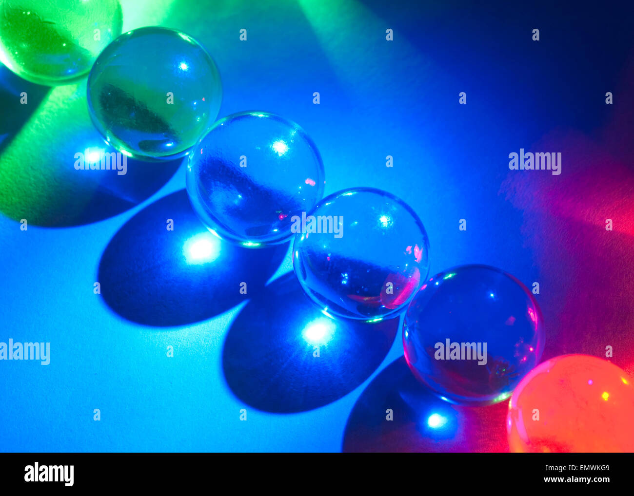 Clear Marbles lit by LED Lights Stock Photo - Alamy