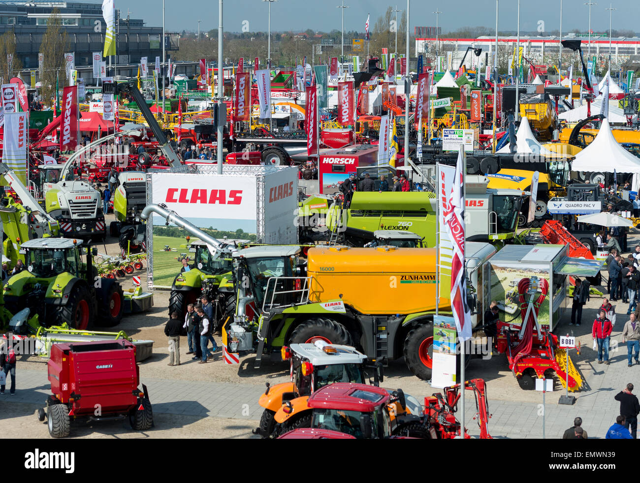 Agricultural vehicles are parked in the outdoor area of the ...
