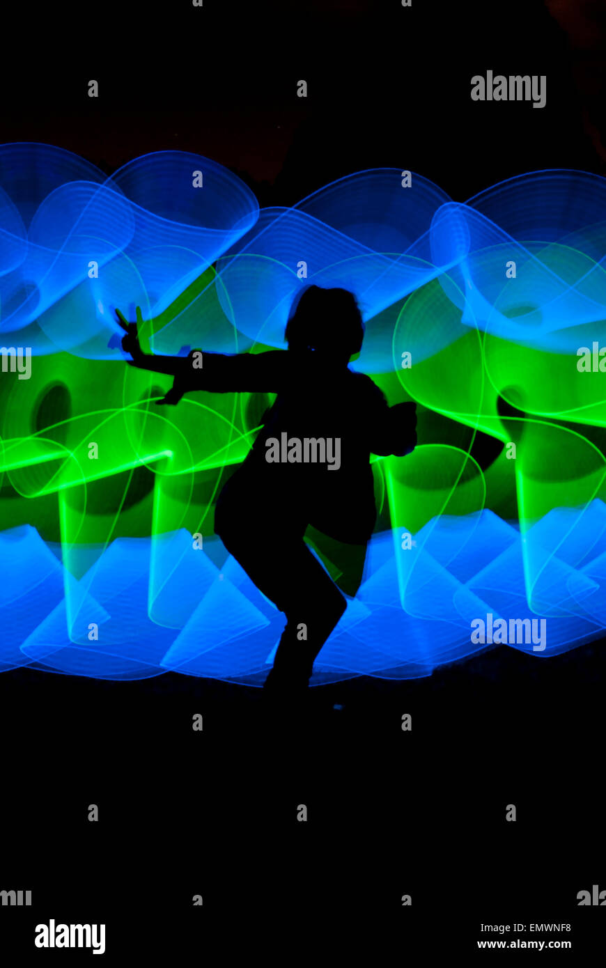 Silhouette of a Girl Dancing - Light Painting Composition Stock Photo ...