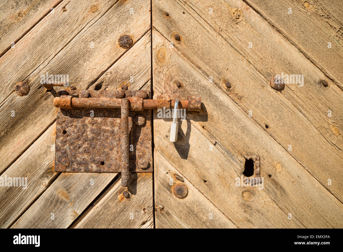 Full frame take of an old door with a rusty bolt Stock Photo - Alamy