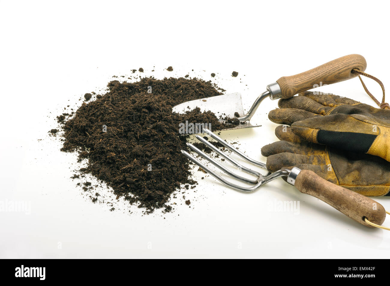 garden tools and soil, isolated on a white background Stock Photo - Alamy