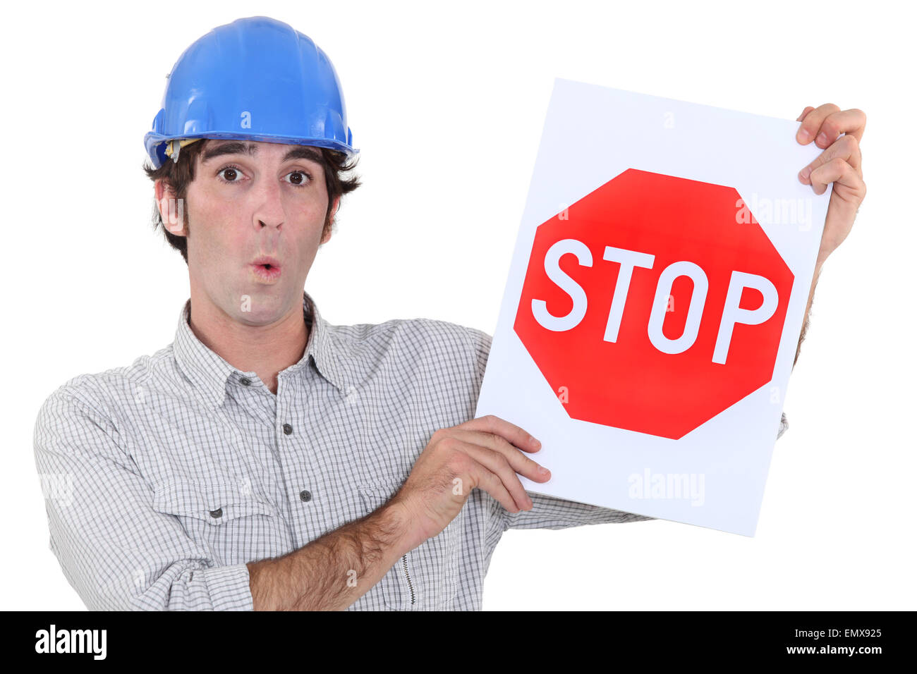 A road worker holding a stop sign Stock Photo - Alamy