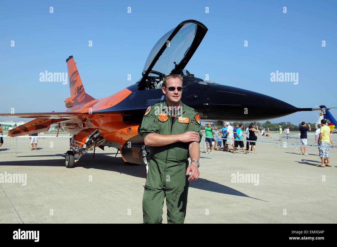 Pilot standing in front of a General Dynamics F-16 Fighting Falcon of ...