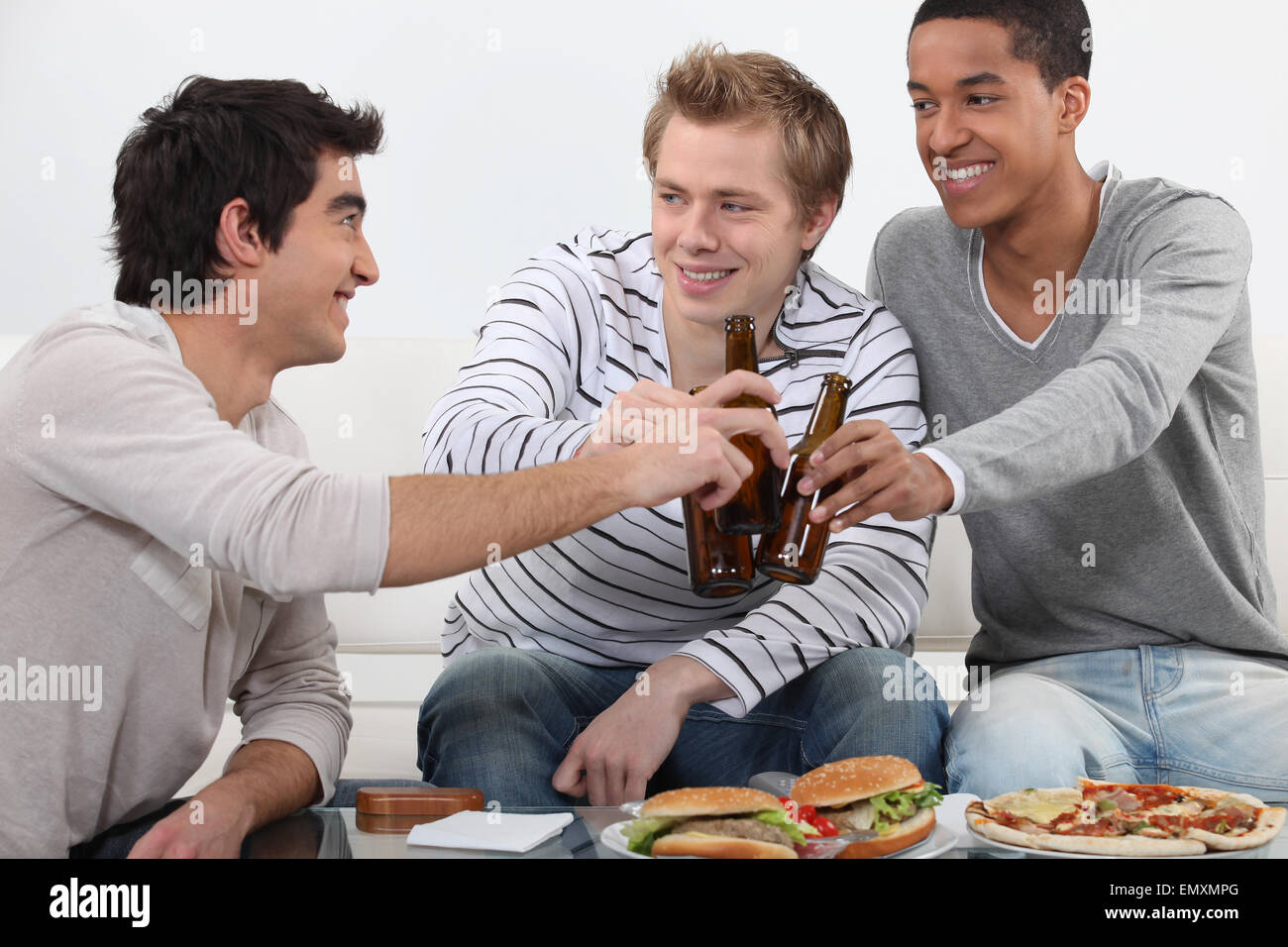 Three friends hanging out Stock Photo - Alamy