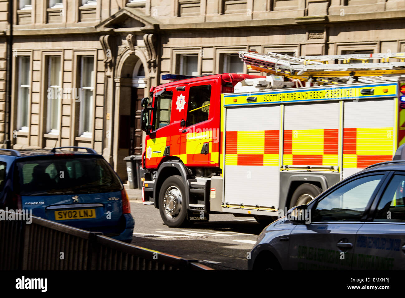 A Scottish Fire and Rescue Service Fire Engine speeding along the ...