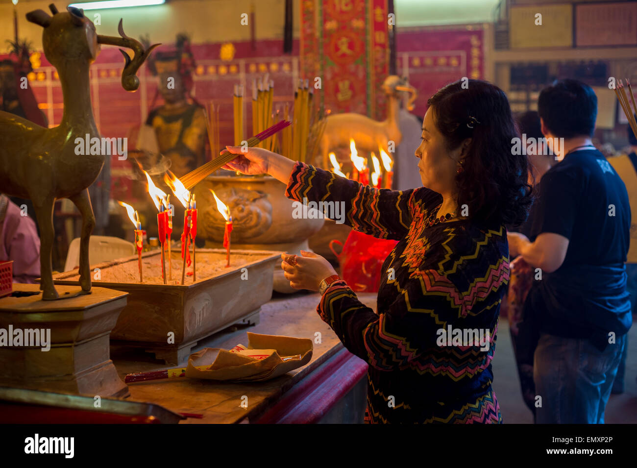 Chinese woman burning incense prayer hi-res stock photography and ...
