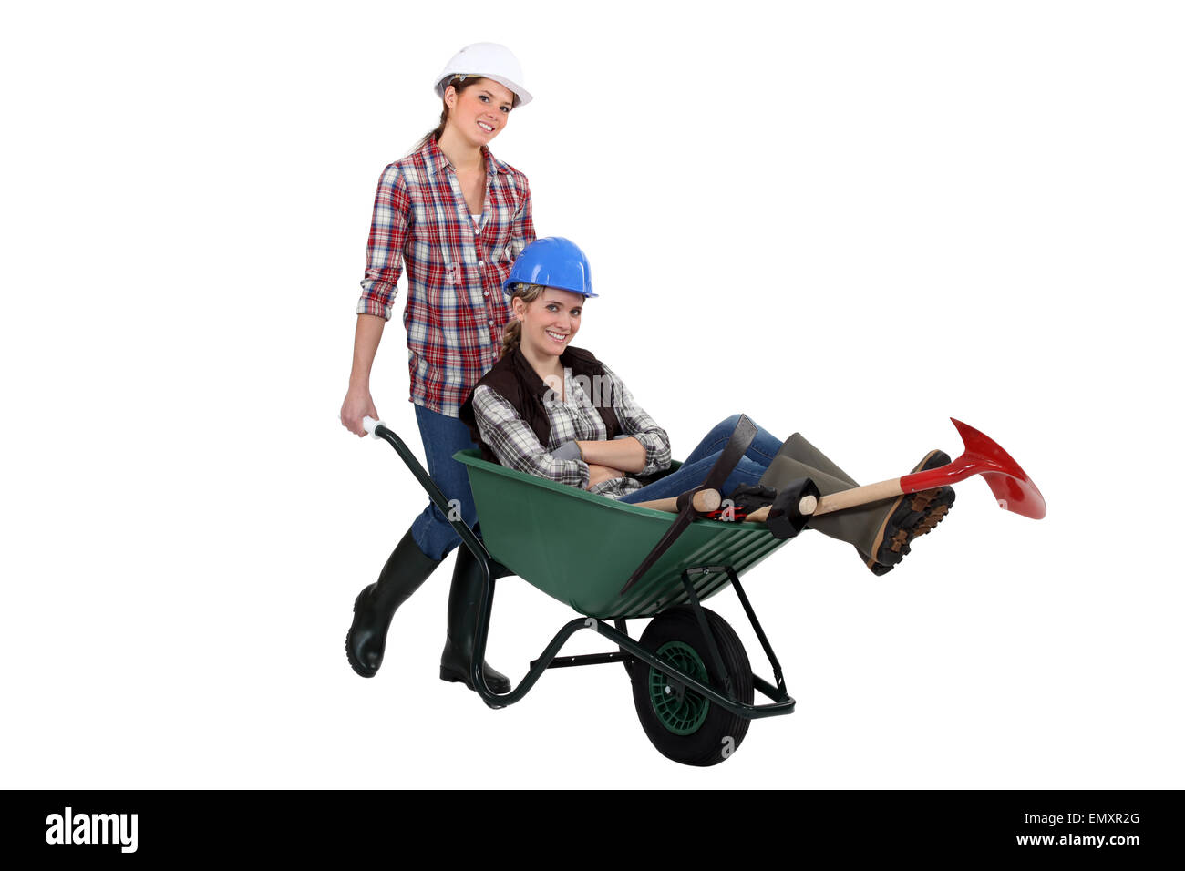 Two women with wheelbarrow Stock Photo - Alamy