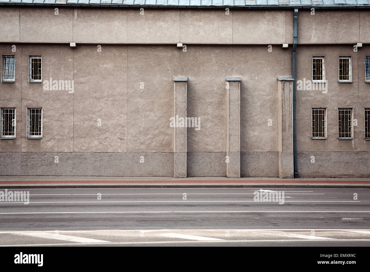 Aged weathered street wall with some windows Stock Photo - Alamy