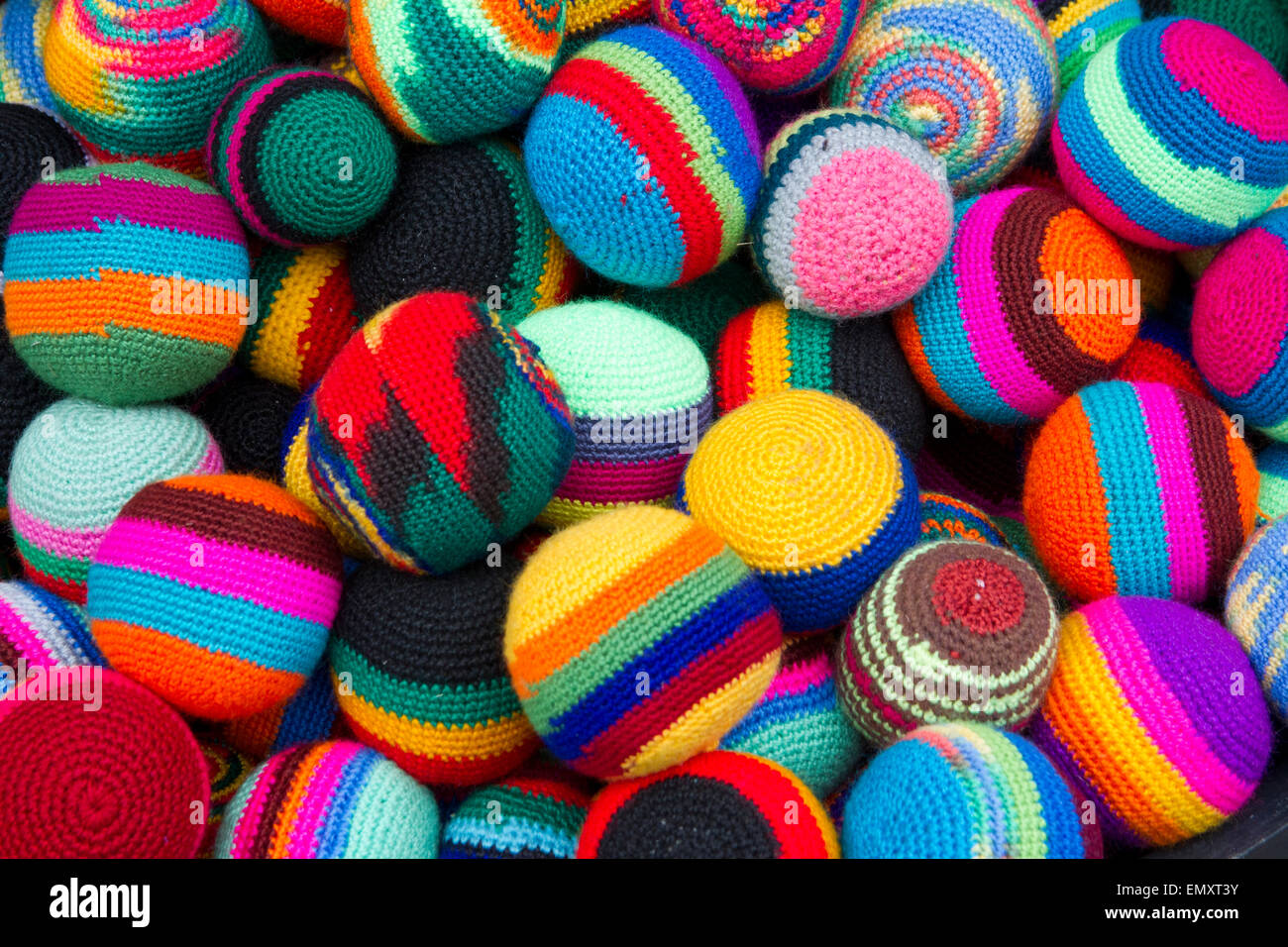 Brightly colored fabrics on display for sale at Otavalo market, Ecuador ...