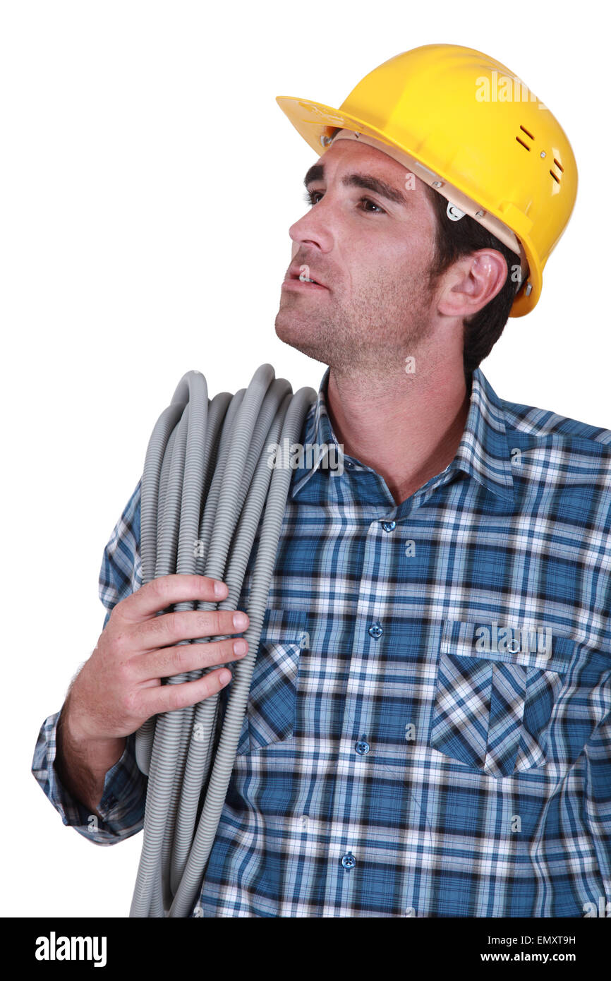 A construction worker looking upwards Stock Photo - Alamy