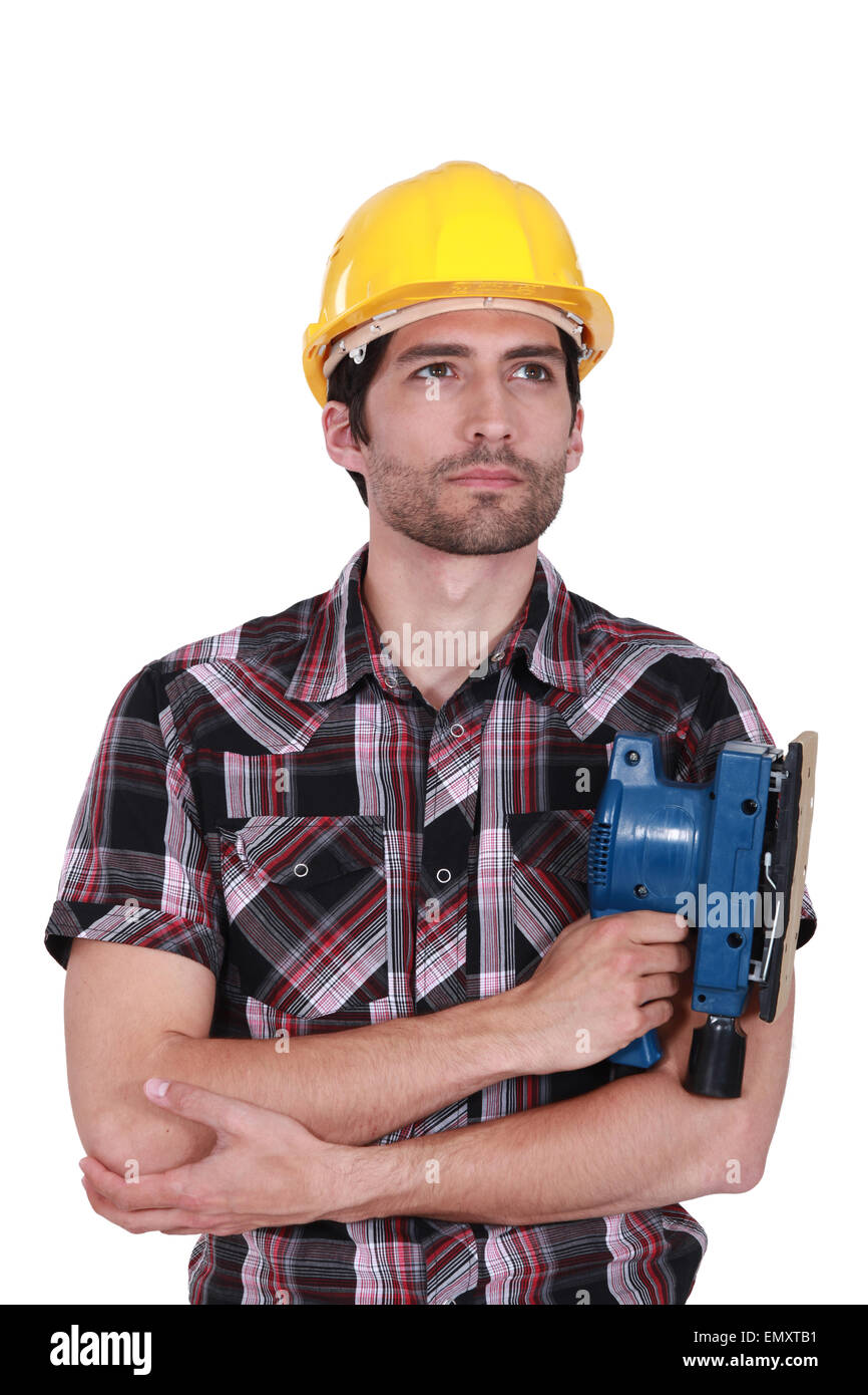 A construction worker with a sander machine Stock Photo - Alamy