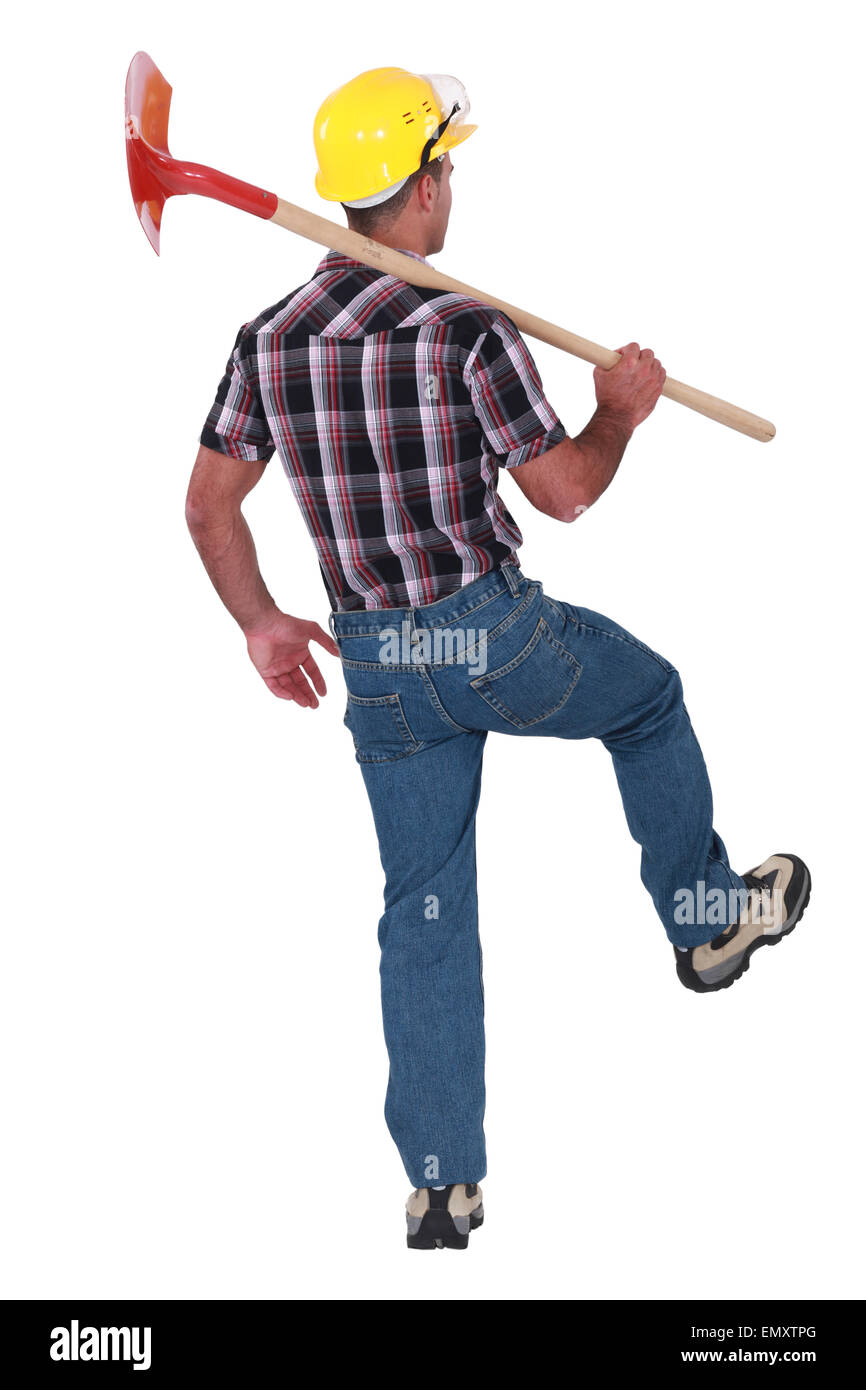 Man stood with shovel Stock Photo - Alamy