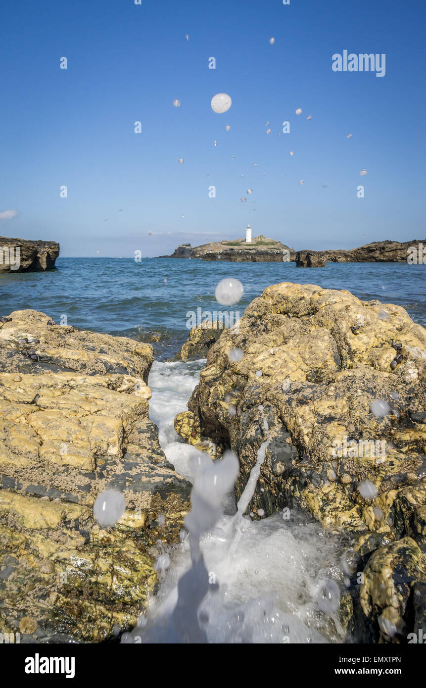 Big splash at Godrevy lighthouse in cornwall england uk Stock Photo - Alamy