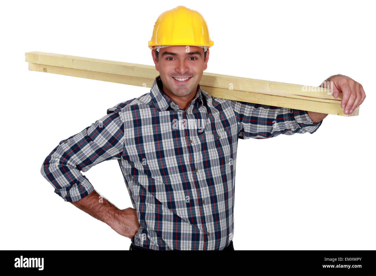 Cheerful carpenter carrying timber Stock Photo - Alamy