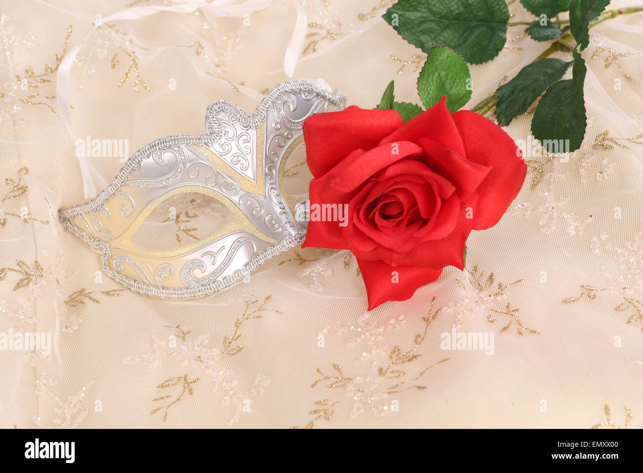 Red rose and mask on an evening dress Stock Photo - Alamy