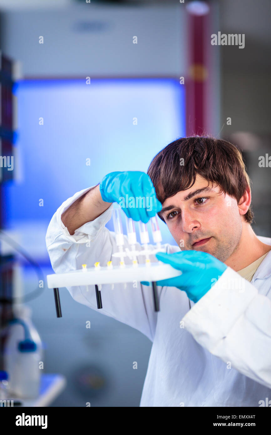 Young male researcher carrying out scientific research in a lab ...