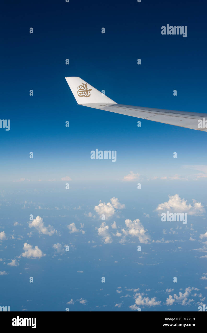 Wing seen through airplane window at high altitude Stock Photo - Alamy