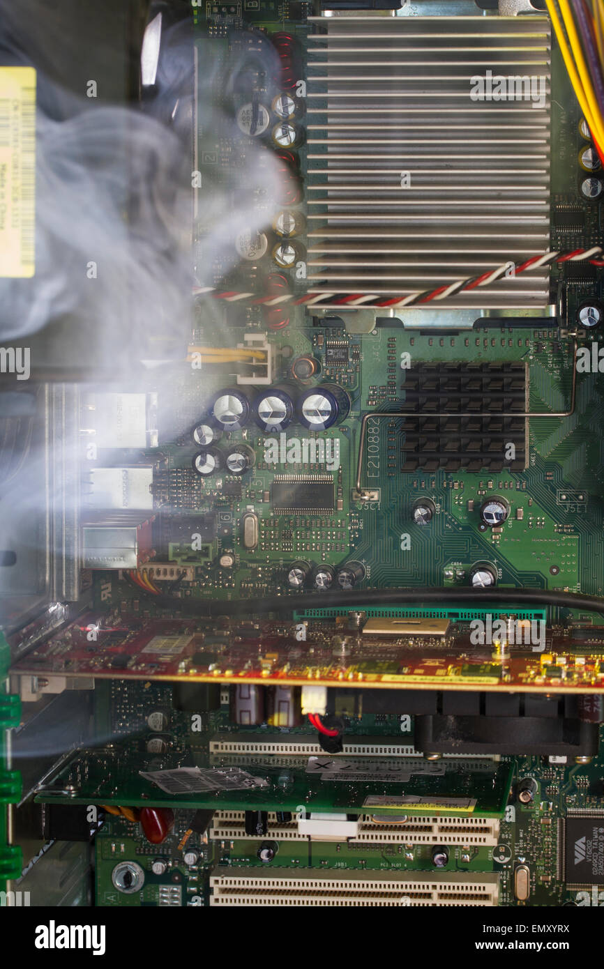 Smoking computer chassis and motherboard Stock Photo - Alamy