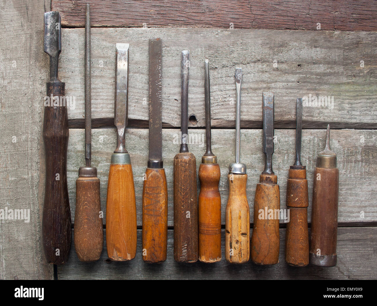 Carpenter tools composition. Old carpenter chisels, screw driver, file ...
