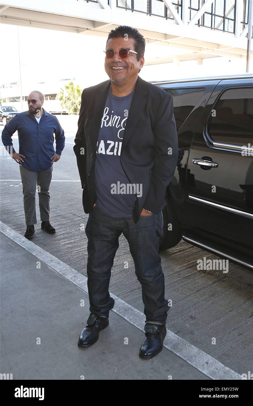 George Lopez smiles as he arrives at LAX as Police and Police dog say ...