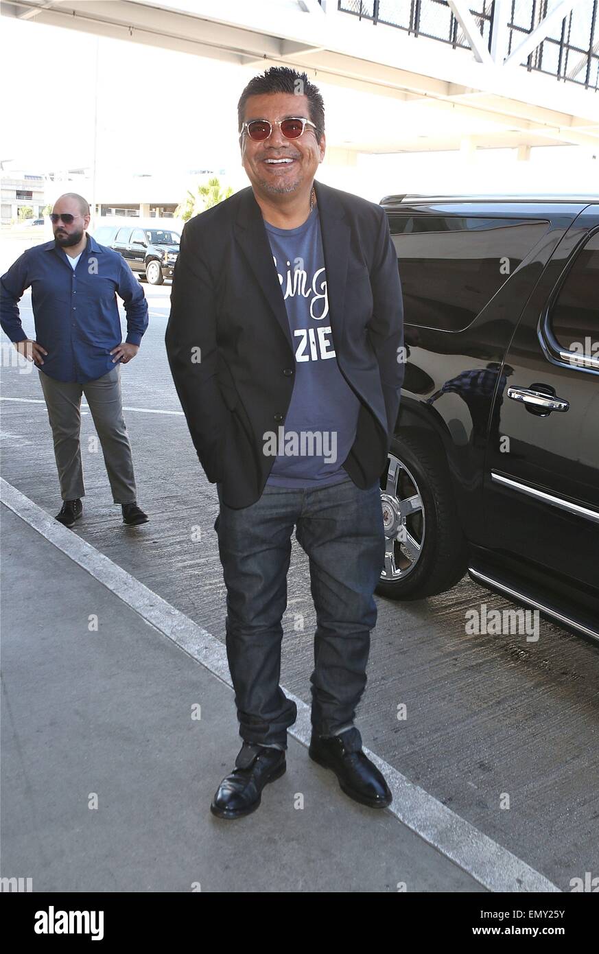 George Lopez smiles as he arrives at LAX as Police and Police dog say ...