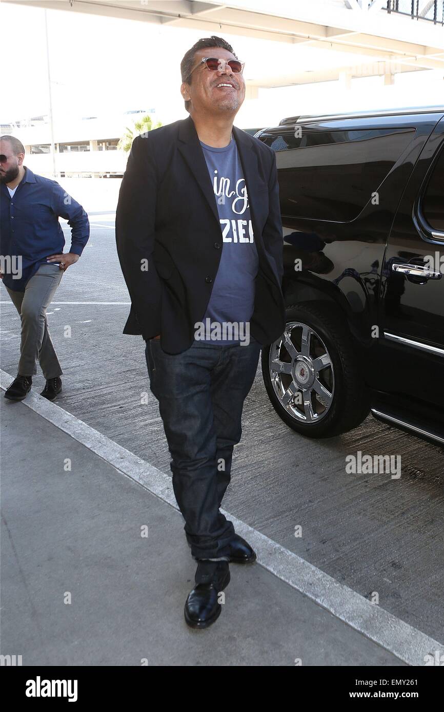 George Lopez smiles as he arrives at LAX as Police and Police dog say ...