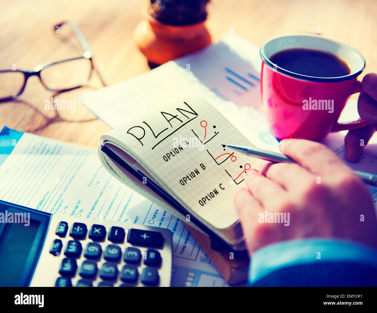 Man Writing Plan in Note Pad Stock Photo - Alamy