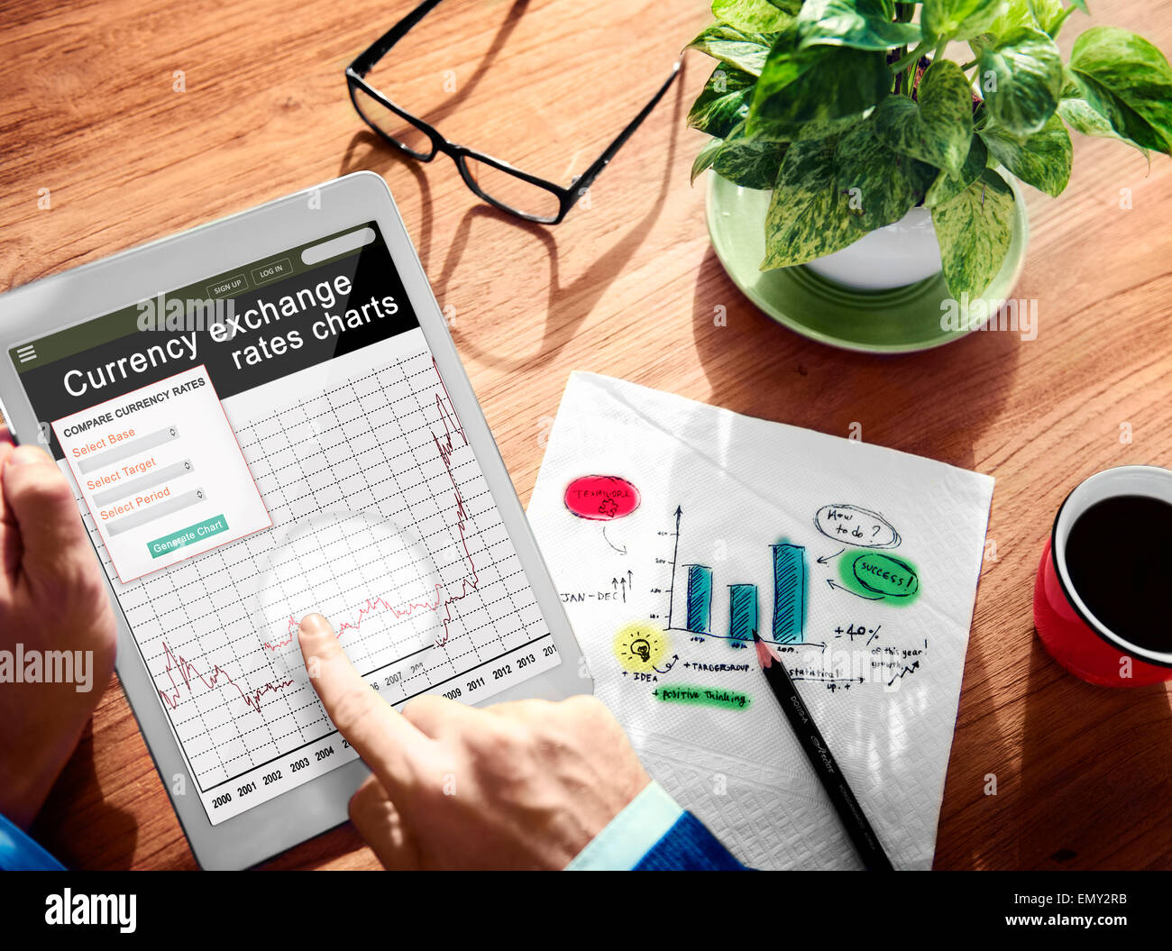 Man Analysis Currency Rate on Tablet Stock Photo - Alamy
