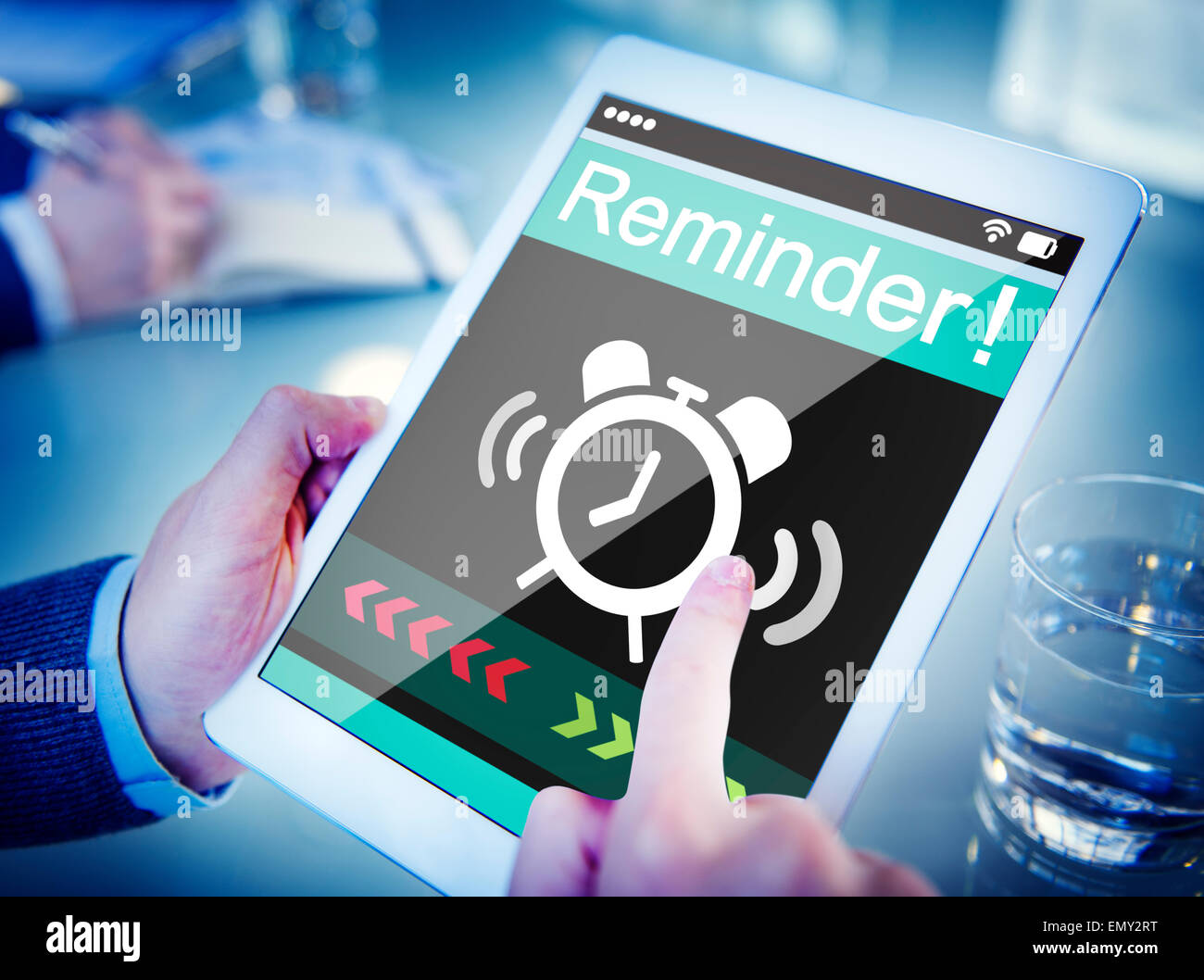 Man Using Digital Tablet with Reminder Stock Photo - Alamy