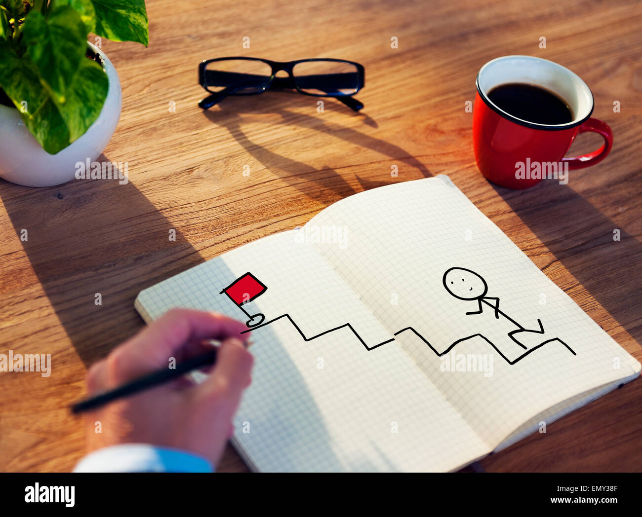 Businessman Drawing Goal Concept on a Note Pad Stock Photo - Alamy