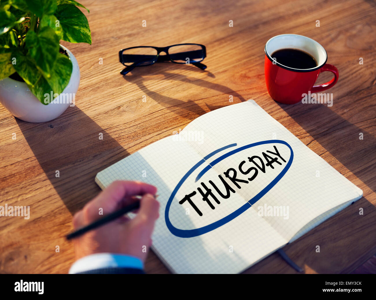 Businessman Writing the Word "Thursday Stock Photo - Alamy