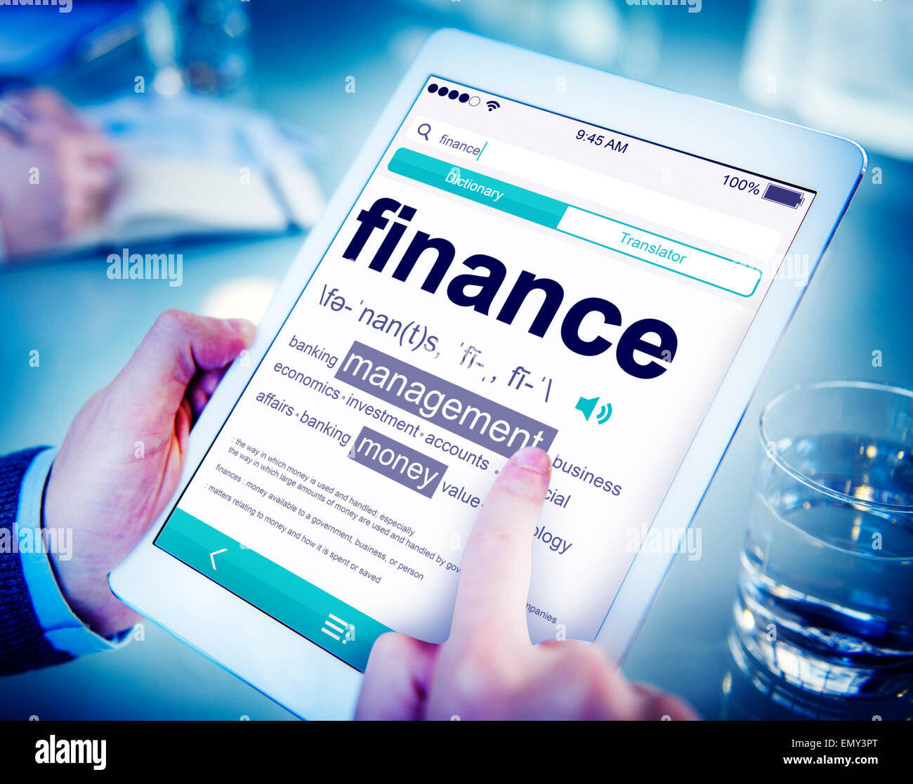 Man Reading the Definition of Finance Stock Photo - Alamy