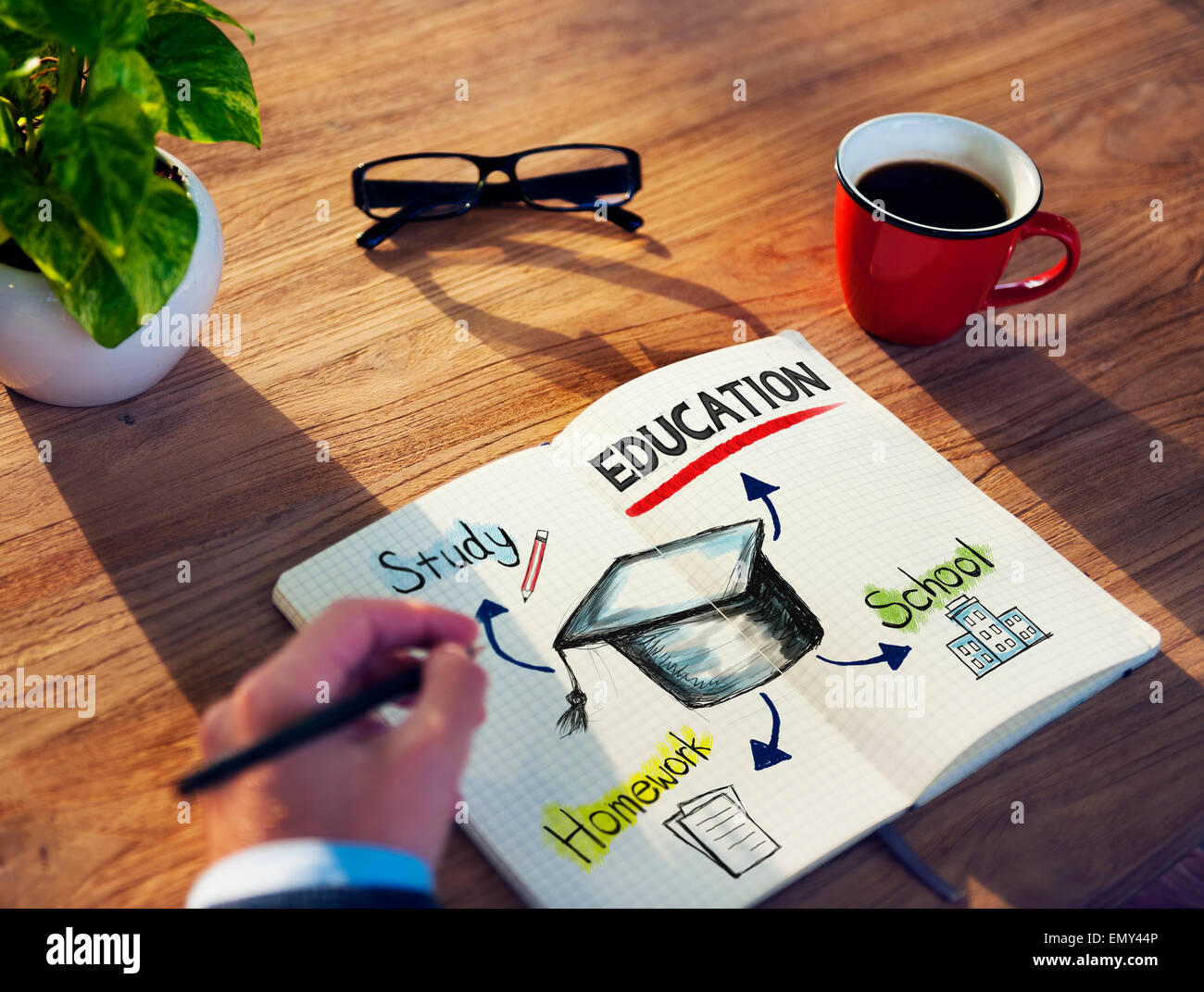 Hand and Notepads with Education Concepts Stock Photo - Alamy