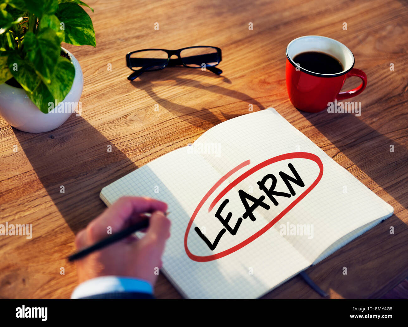 Man with Note Pad and Learning Concepts Stock Photo - Alamy