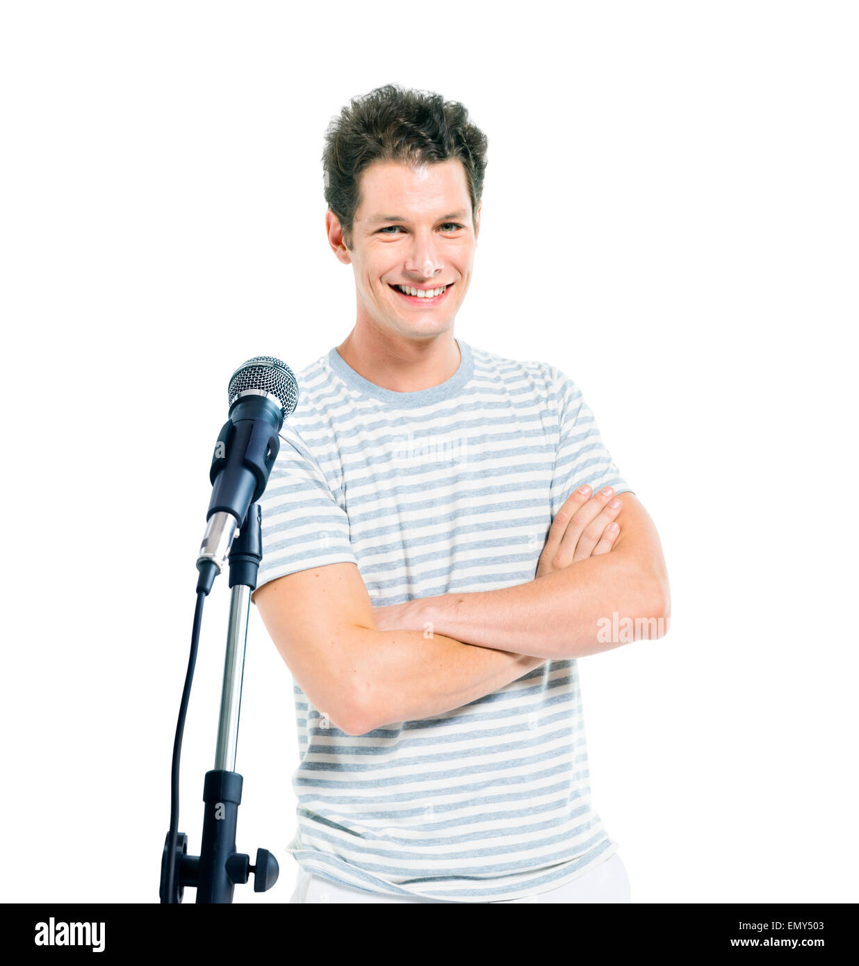 A man standing in front of a microphone Stock Photo - Alamy