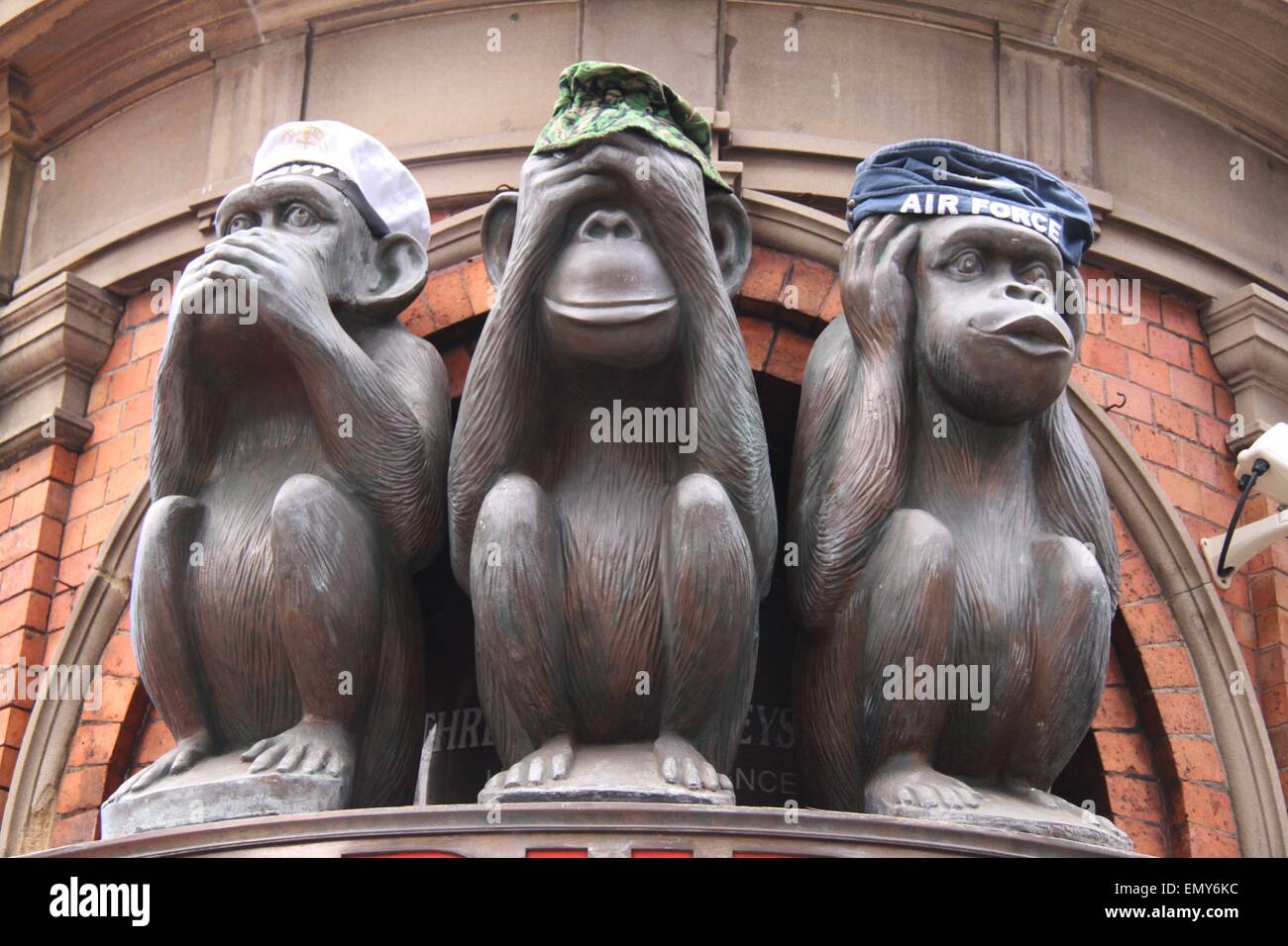 The three monkeys wear hats representing the navy, army and air force ...