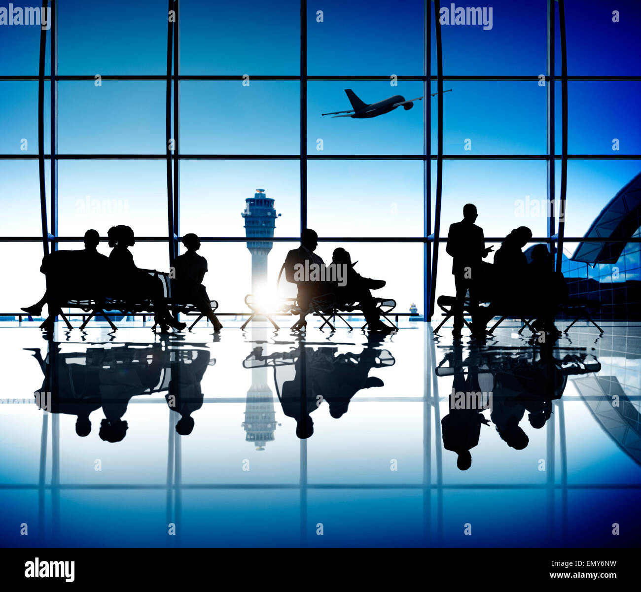 Group of business people waiting in an airport Stock Photo - Alamy